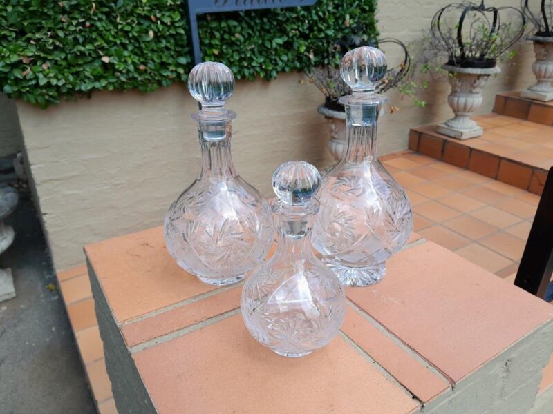 A Set of Three Neman Cut Crystal Decanters - The Crown Collection